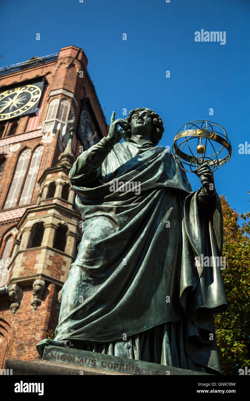 Torun„, Poland, the Copernicus Monument with the Town Hall Tower Stock ...