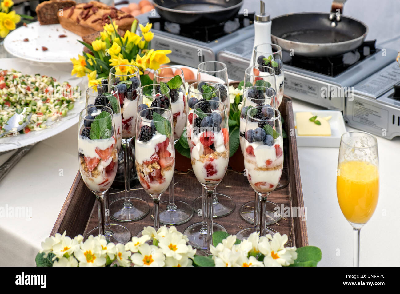 A breakfast buffet with a selection of fresh fruit and berries Stock ...