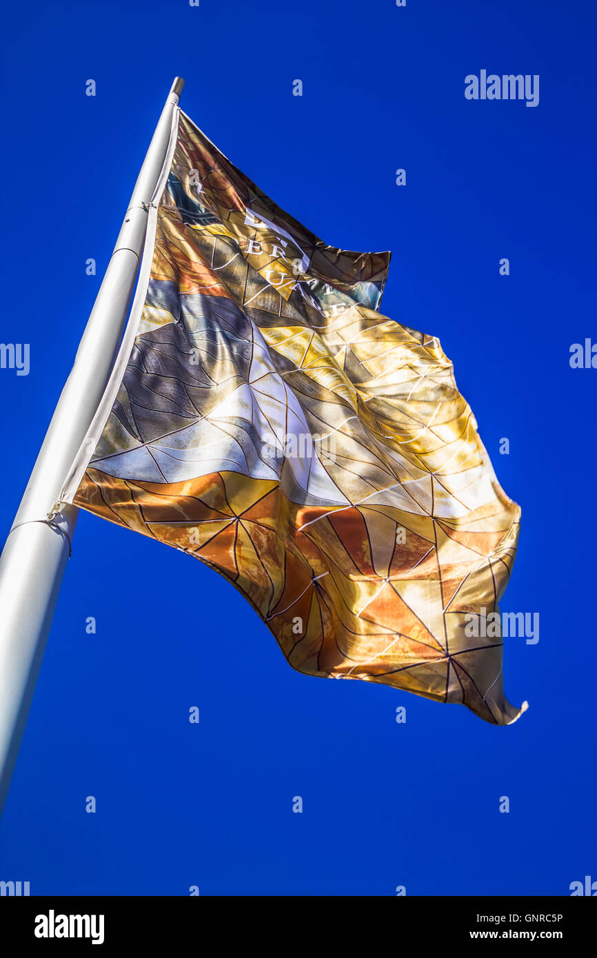 Flag waving against deep blue sky, Federation Square Melbourne ...