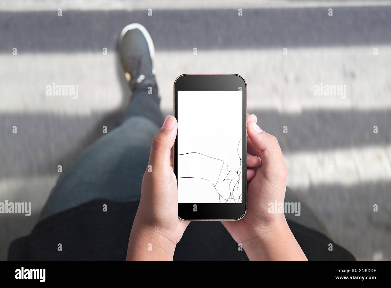 Walking and use smart phone blank screen on crosswalk Stock Photo - Alamy