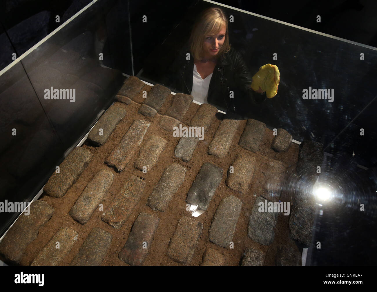 Laura Good polishes the cabinet which holds the original cobbles from ...
