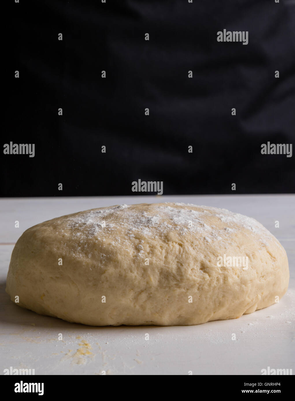 piece of dough on white table with flour Stock Photo - Alamy