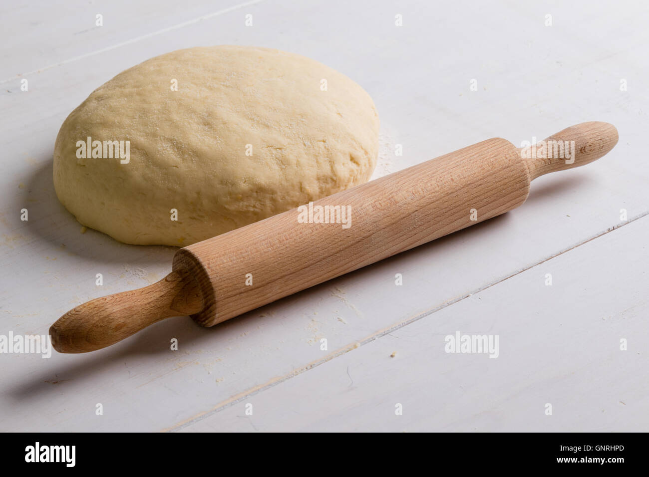 piece of dough on white table with rolling pin Stock Photo - Alamy