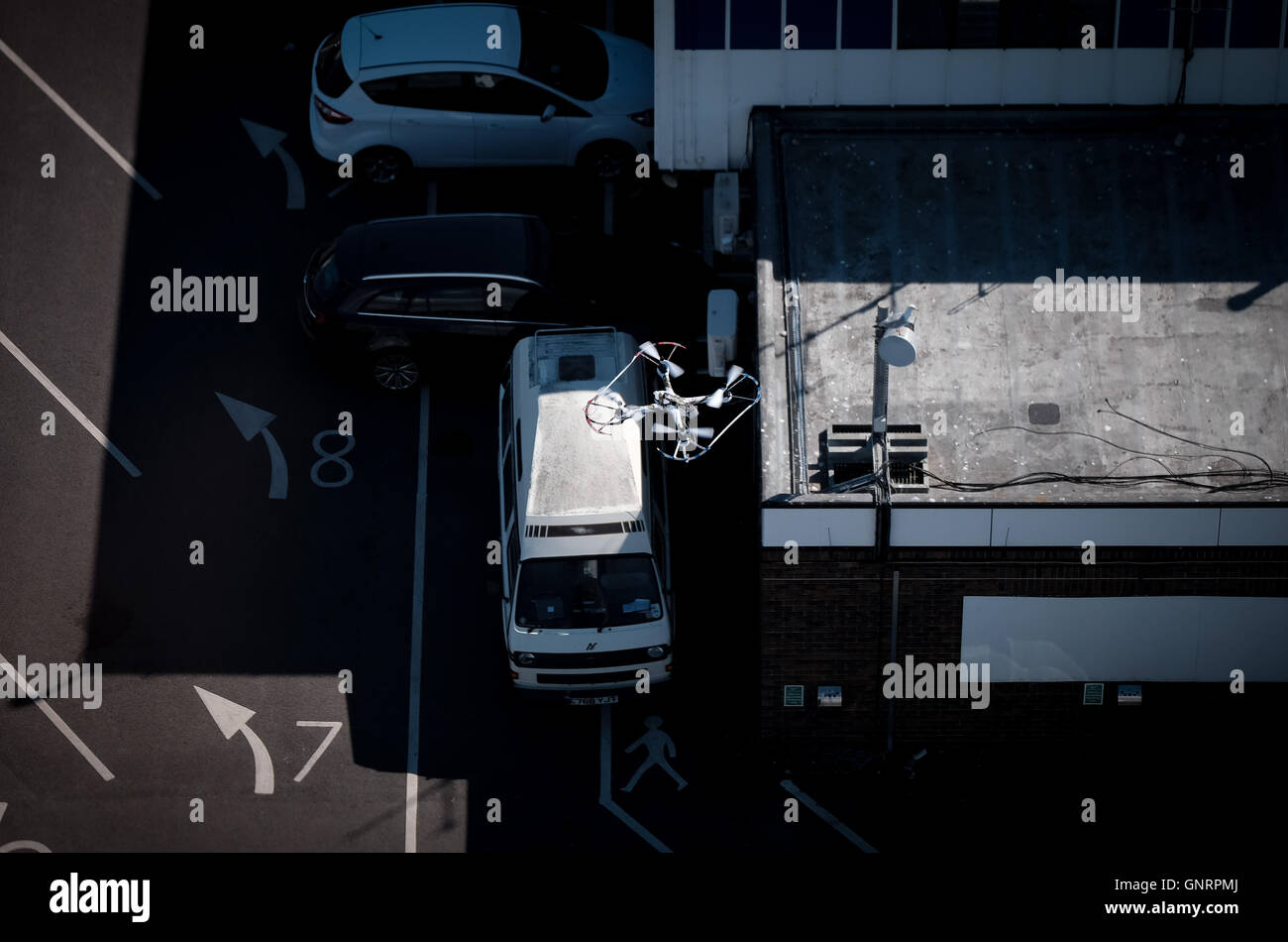 A flying drone photographed from above Stock Photo - Alamy