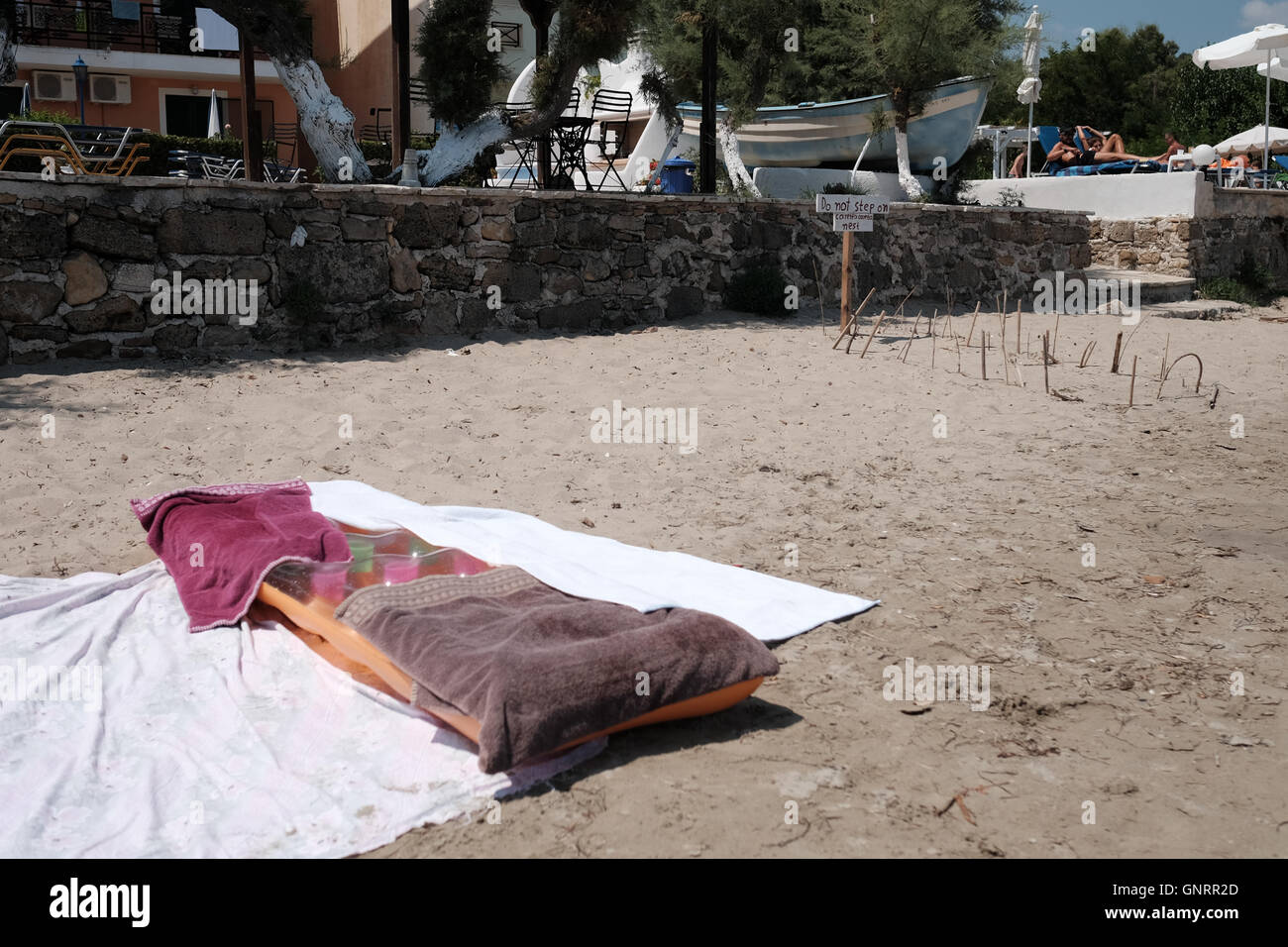 Warning marking out a Turtle nest on a beach in Zante Greece Stock ...