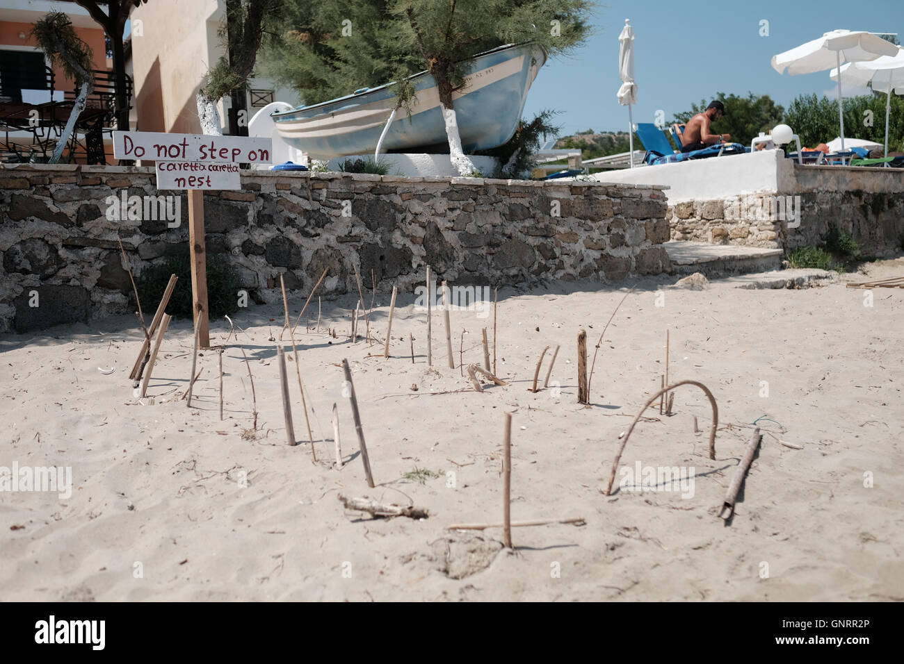 Warning marking out a Turtle nest on a beach in Zante Greece Stock ...