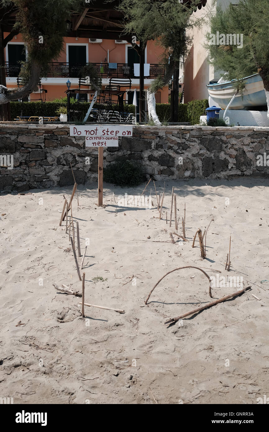Warning marking out a Turtle nest on a beach in Zante Greece Stock ...