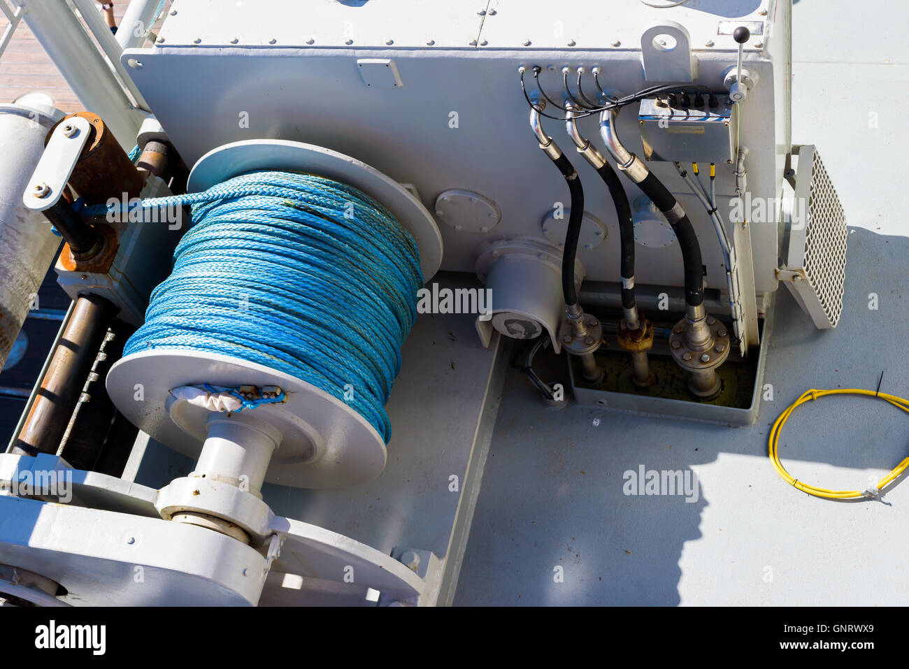 Large spool with blue plastic rope on a tugging winch on a ship Stock ...