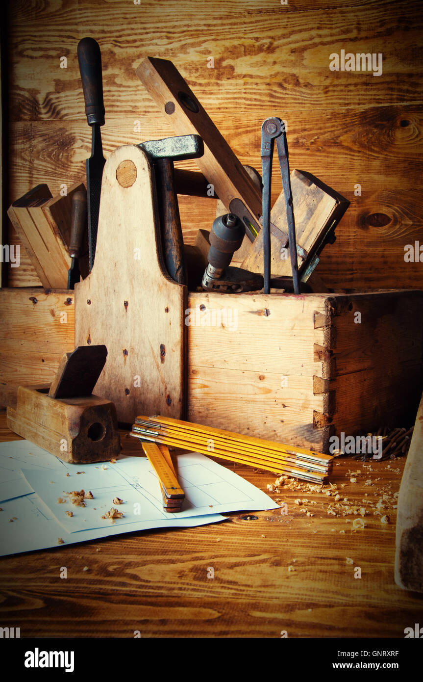 Equipment carpenter on a wooden desk with plans Stock Photo - Alamy