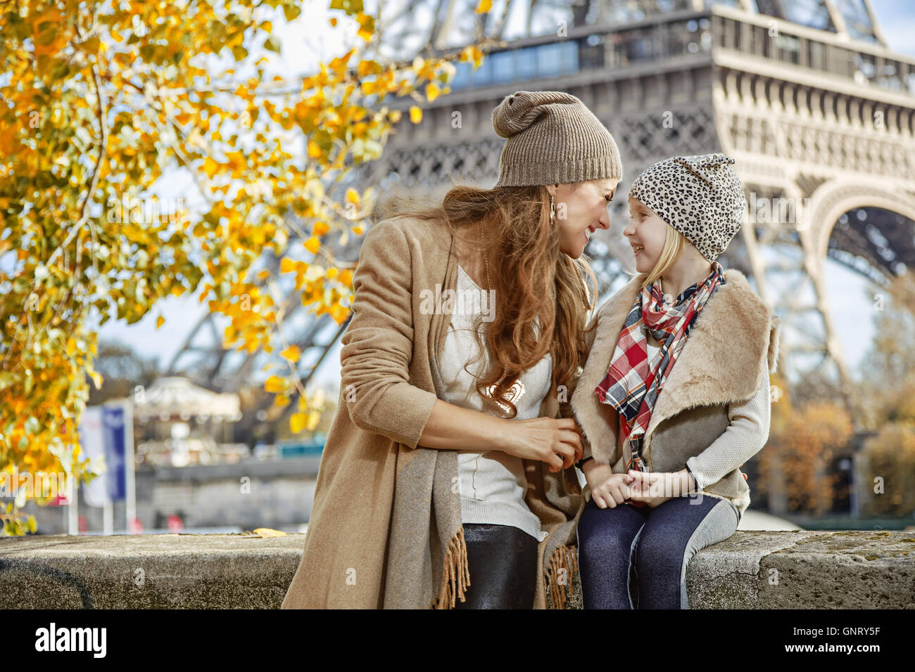 Autumn getaways in Paris with family. Portrait of smiling mother and ...