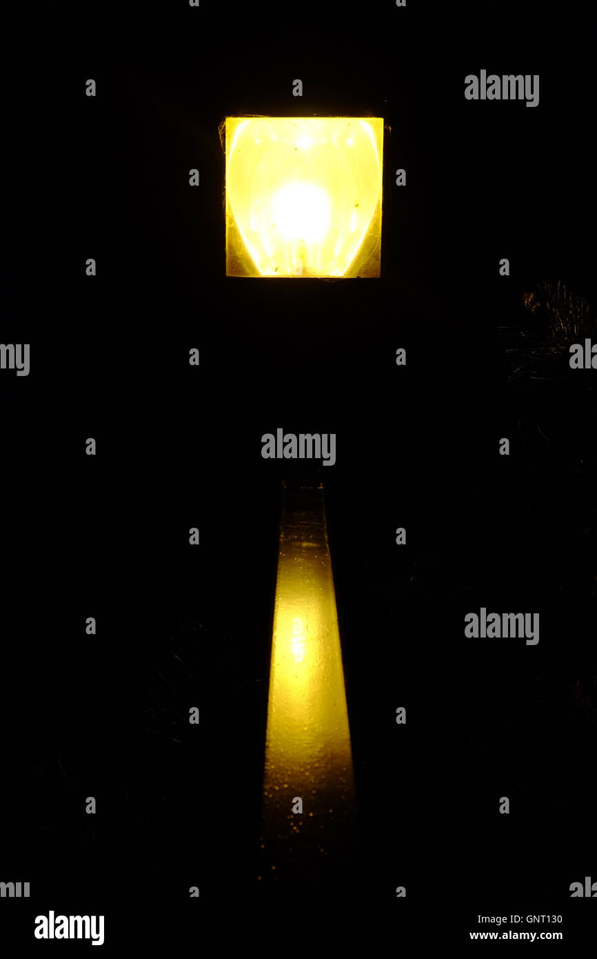 Under a street lamp hi-res stock photography and images - Alamy