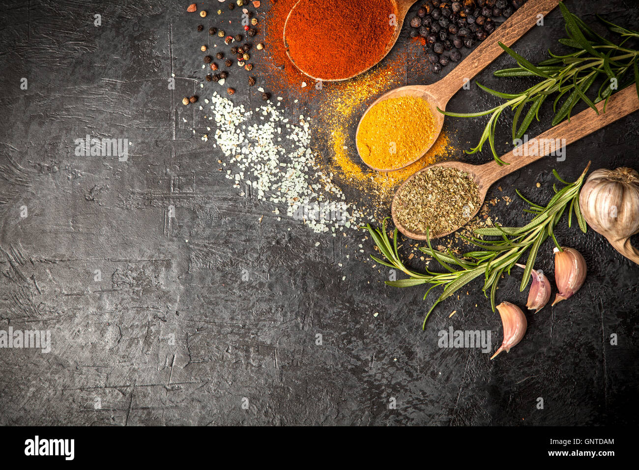 Spice on dark background Stock Photo - Alamy