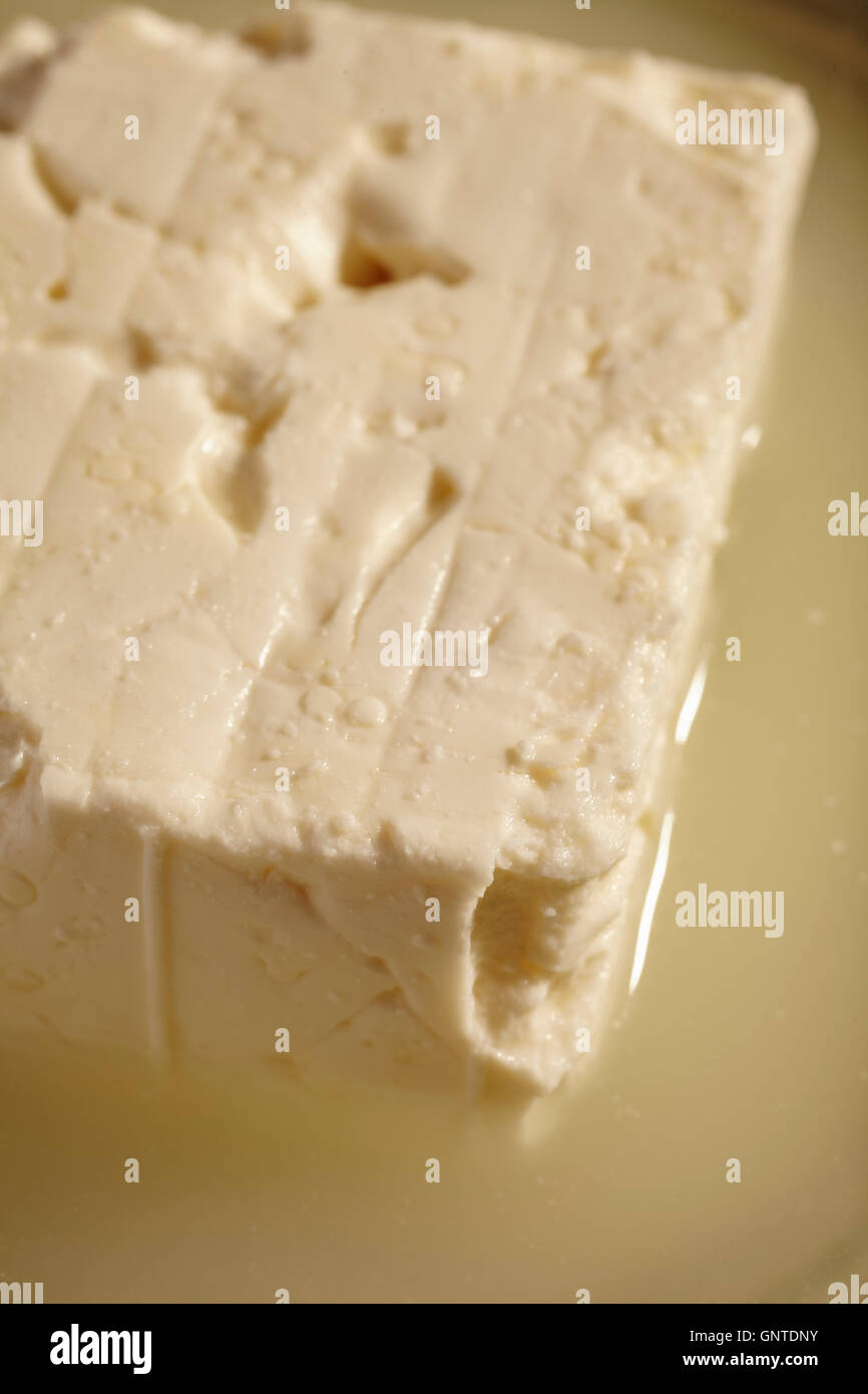 a block of Greek sheep milk feta cheese in brine Stock Photo - Alamy