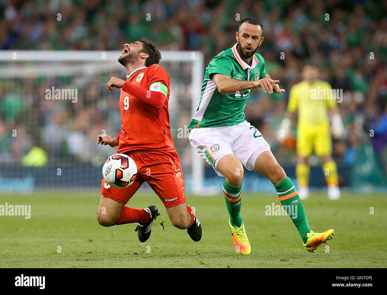 Oman's Abdulaziz Al-Muqbali and Republic of Ireland's Mark Wilson ...