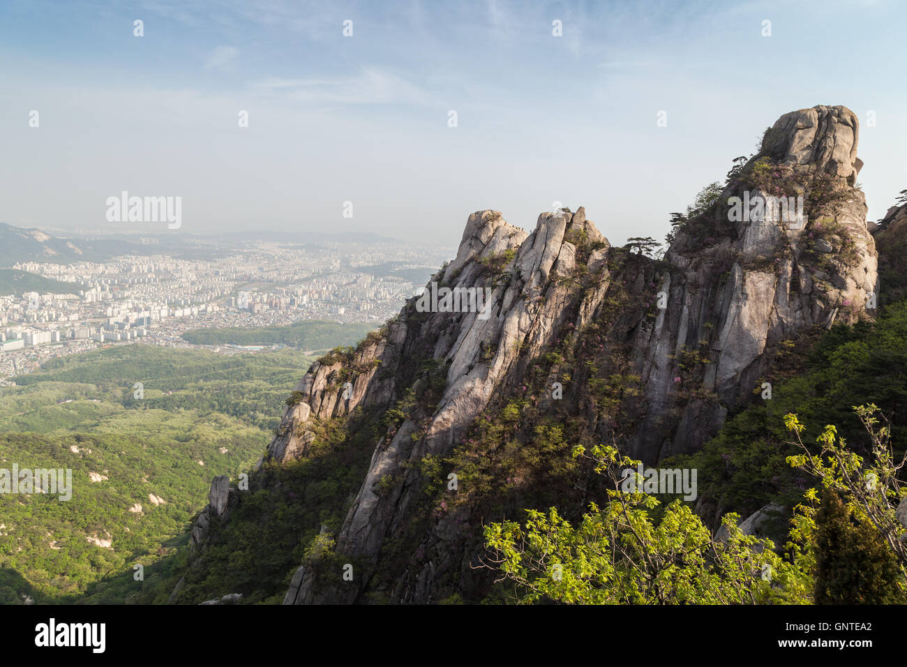View of city from above & granite peaks of Jaunbong Peak on Dobongsan ...