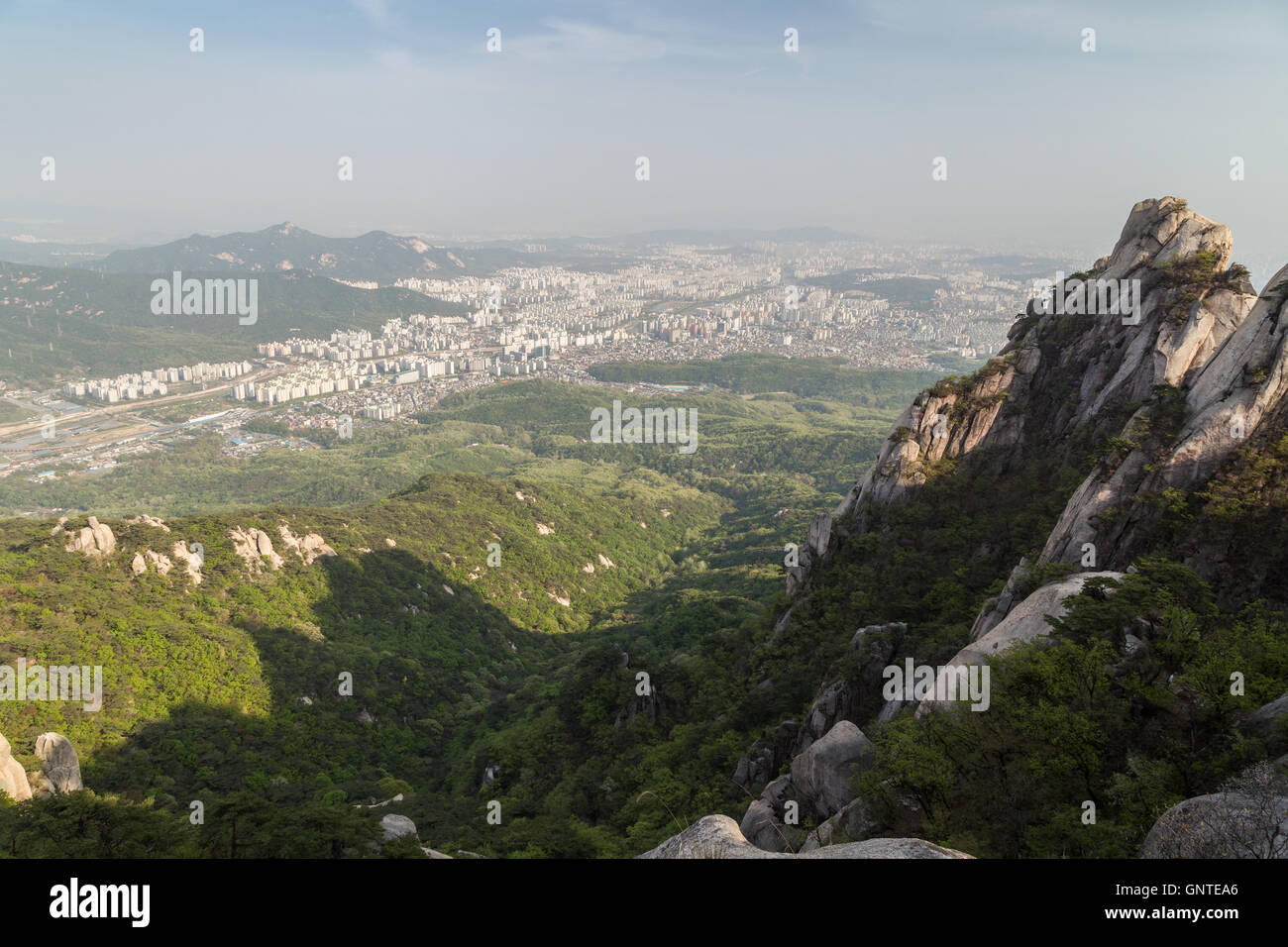 View of city from above & granite peaks of Jaunbong Peak on Dobongsan ...