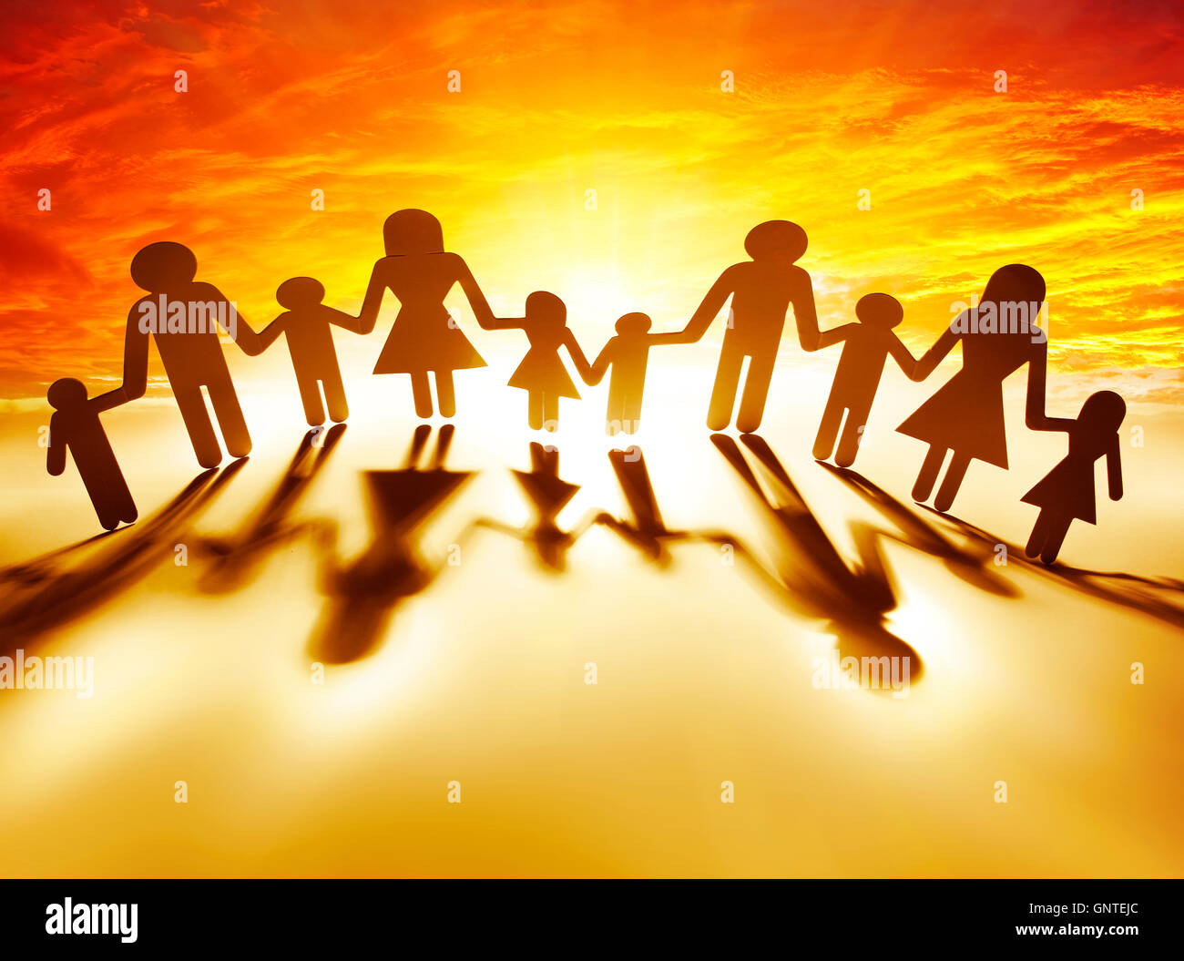 Family paper chain cutout holding hands Stock Photo - Alamy