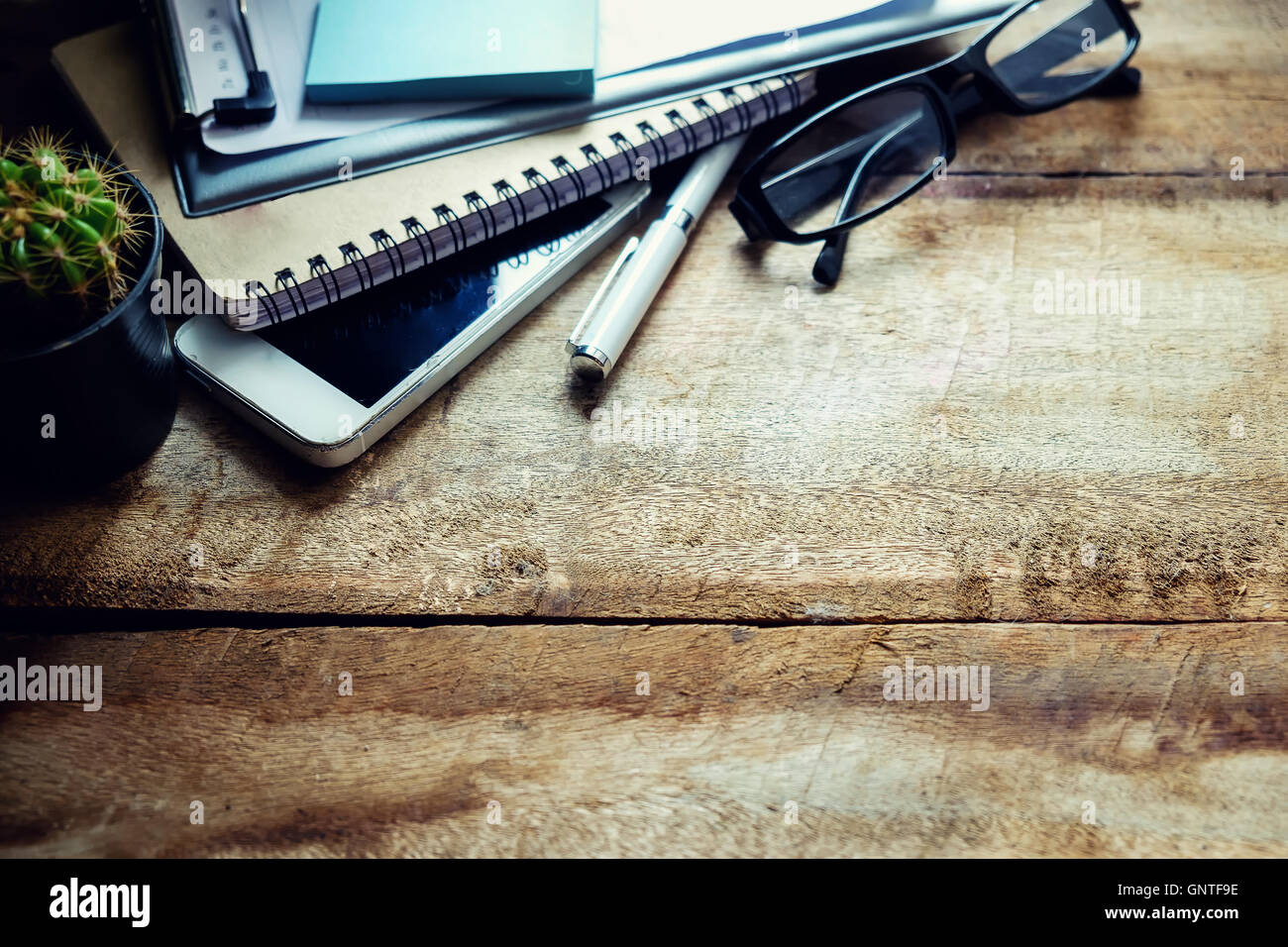 Business concept with notepad,pencil,agenda, smart phone and calculator ...