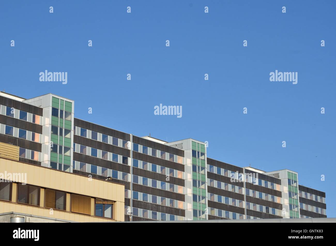 Big office building and blue sky background Stock Photo - Alamy