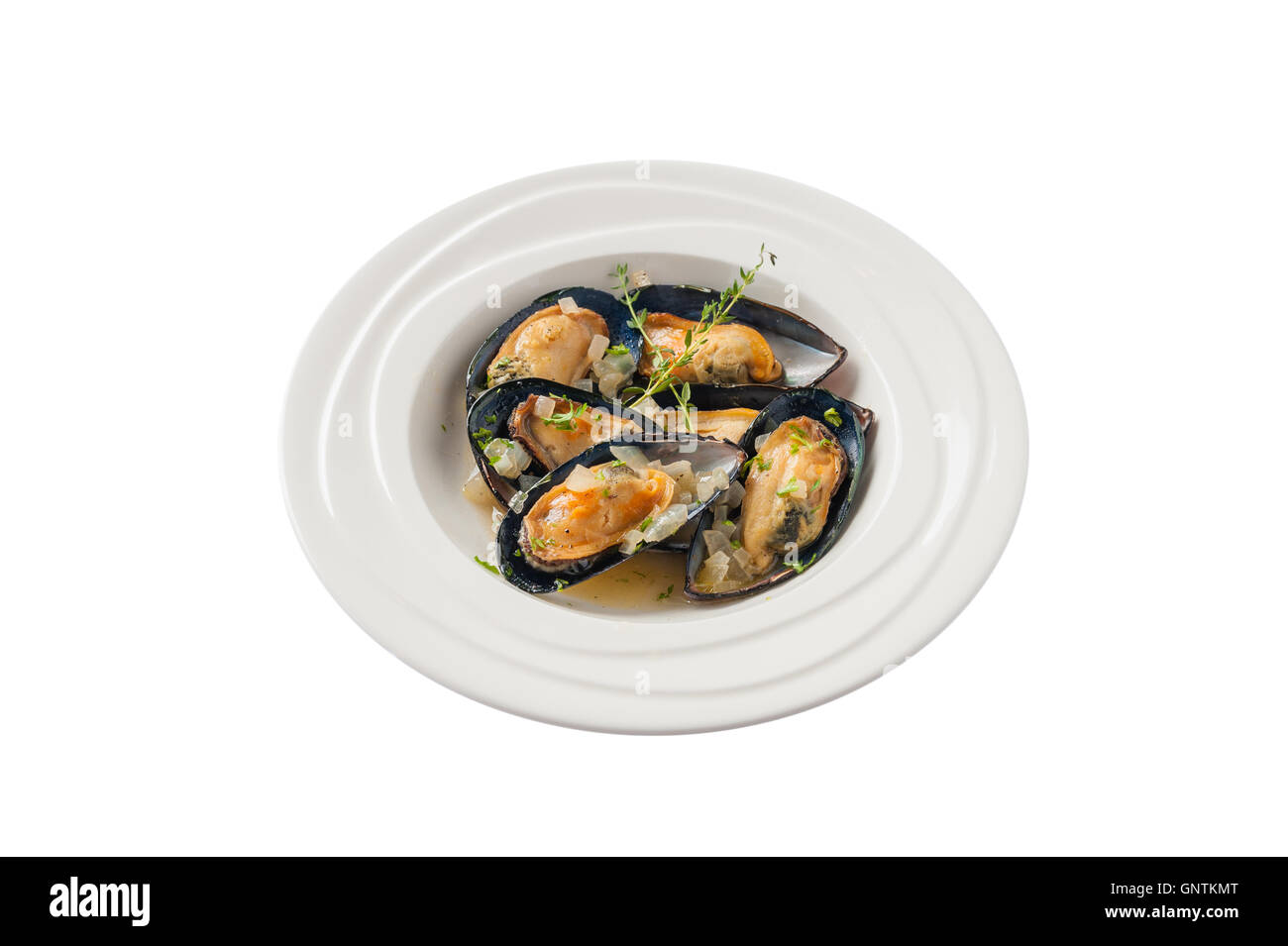 Front view of European style baked mussels with herbs in ceramic dish ...
