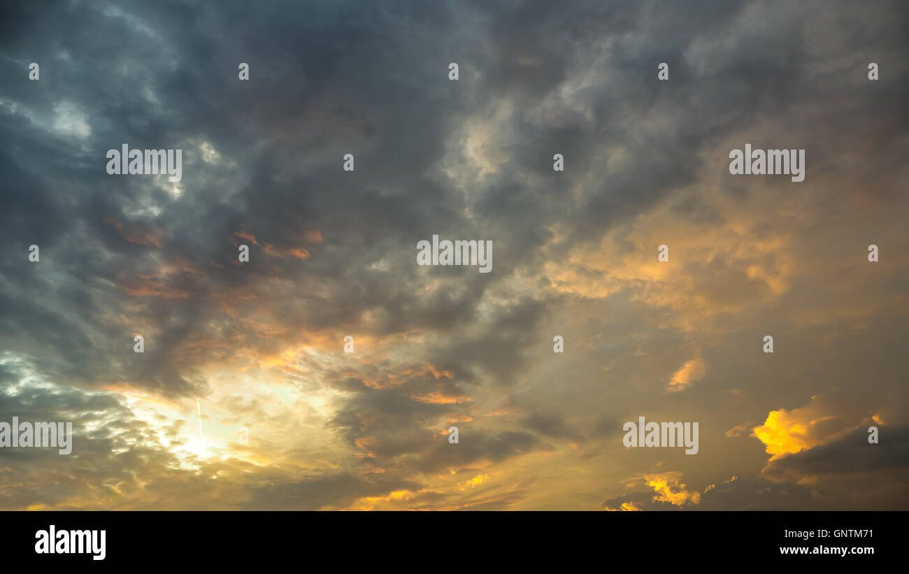 Background of dramatic sky with clouds at sunset or sunrise in HDR ...