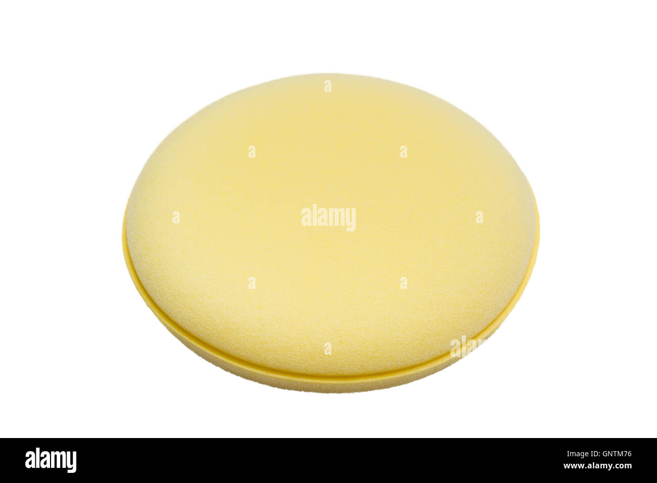 A round yellow car wax sponge. Isolated on white background with ...