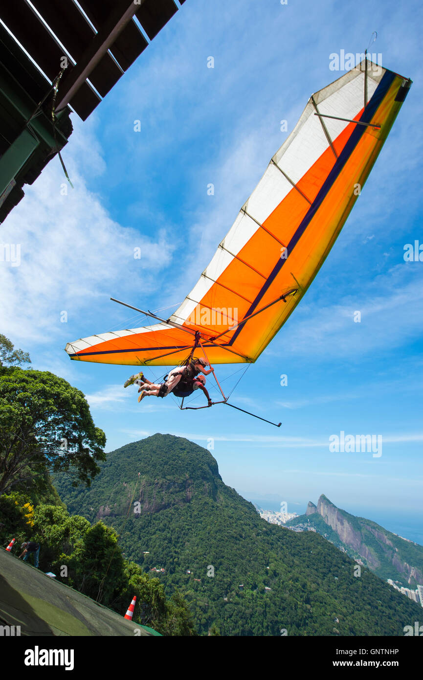 RIO DE JANEIRO - MARCH 22, 2016: A hang gliding instructor takes off ...