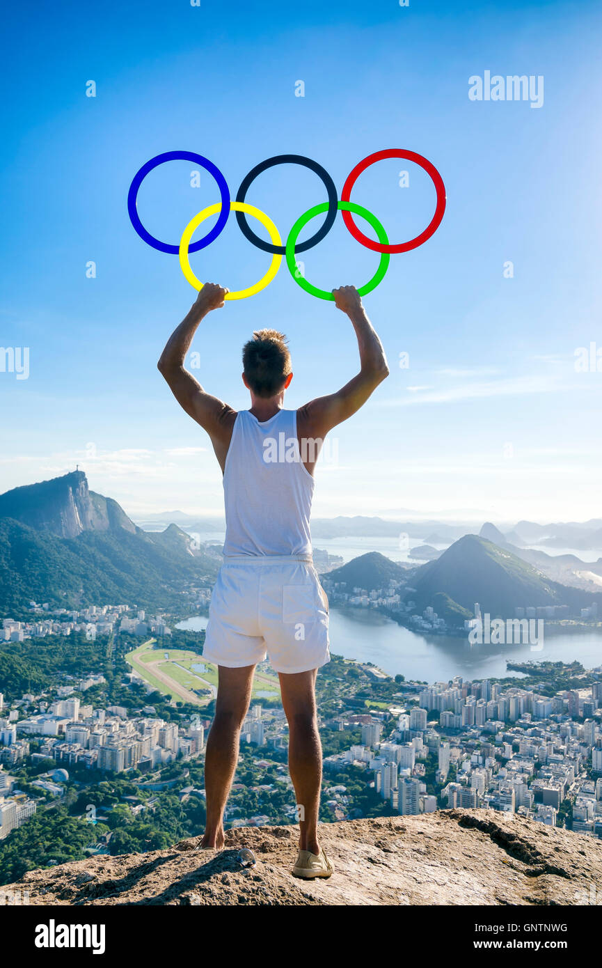 RIO DE JANEIRO - MARCH 21, 2016: An athlete holds Olympic rings under ...