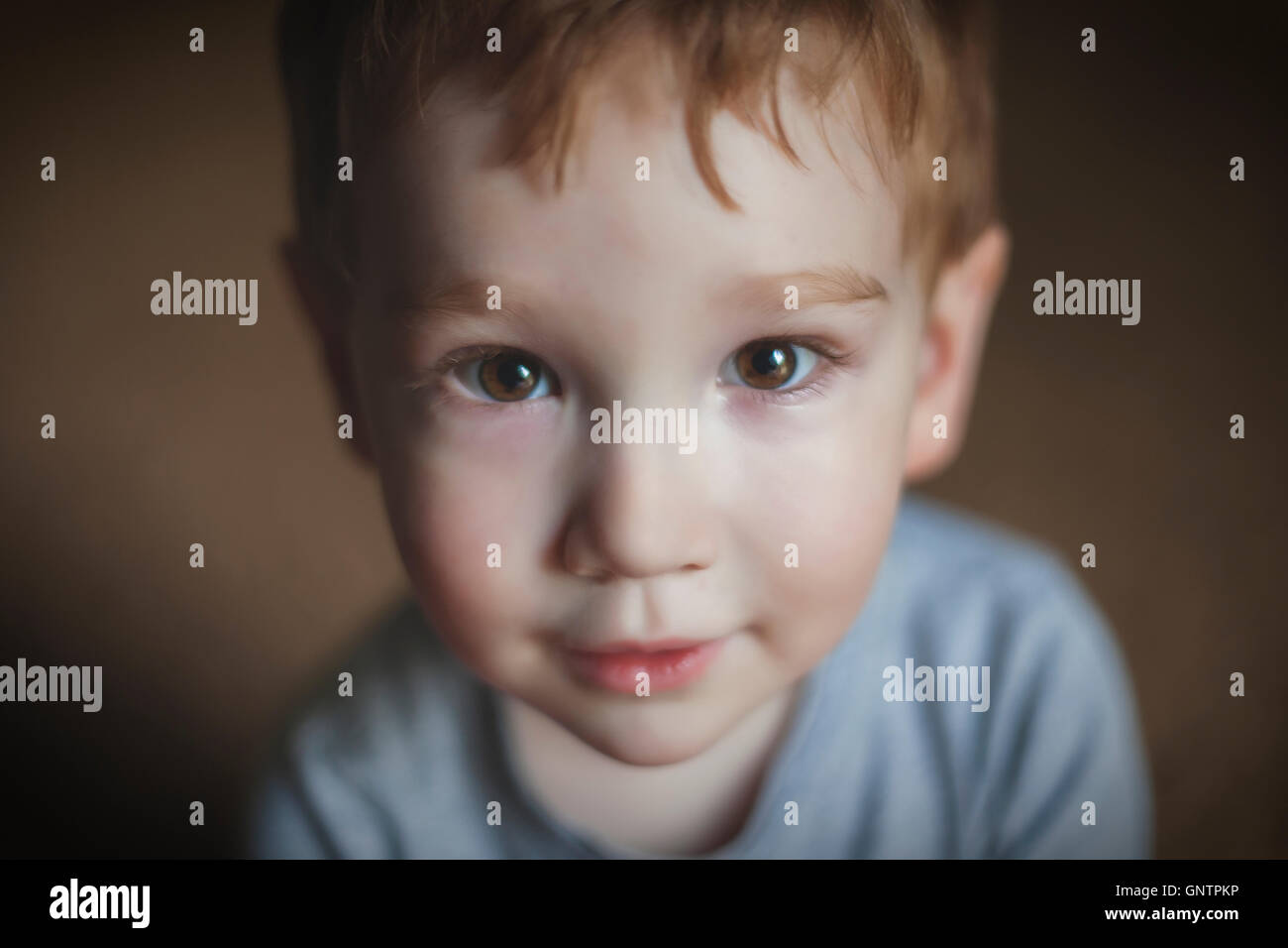 A close up portrait of a cute young boy looking at the camera Stock ...