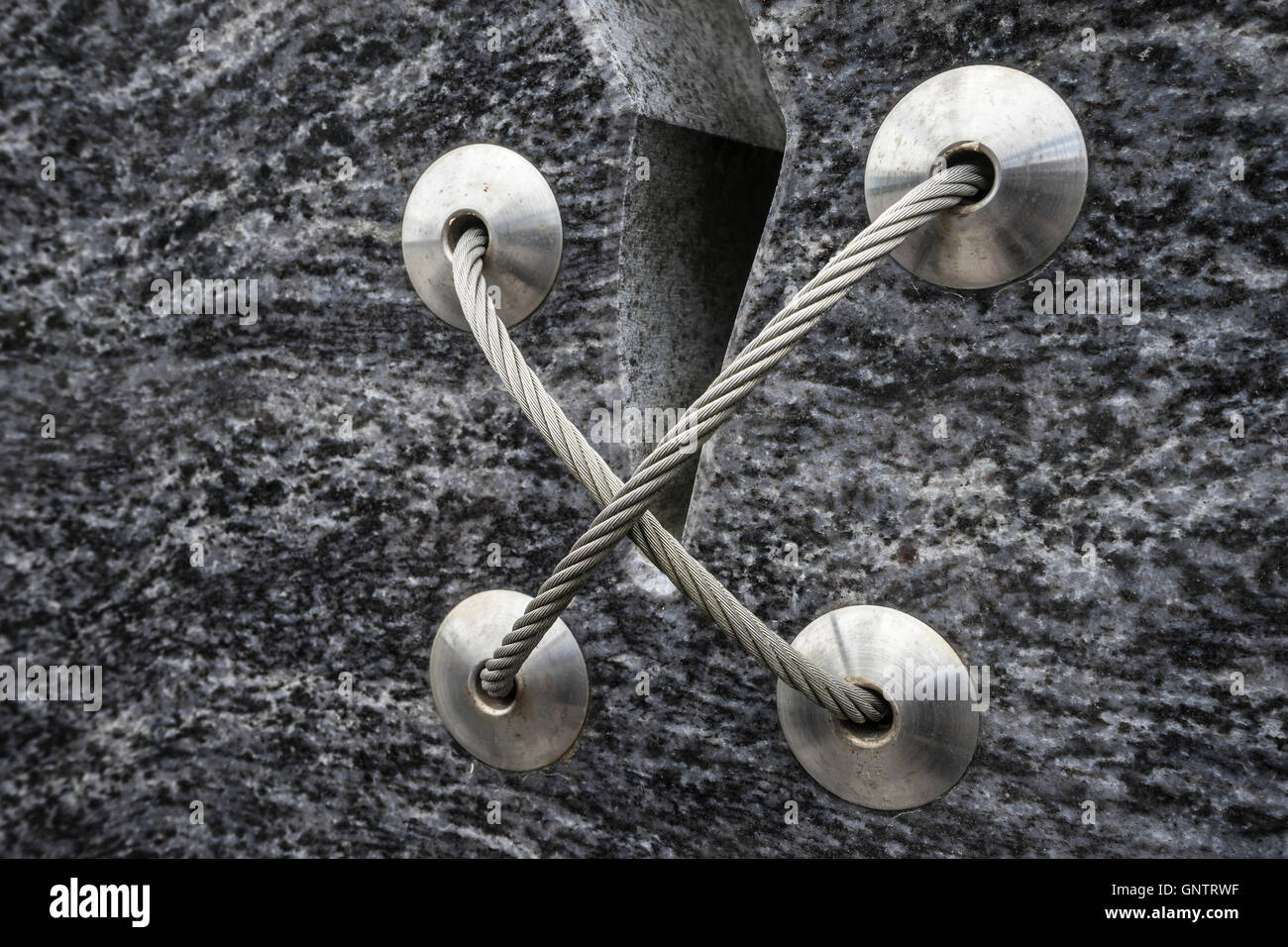 stainless steel rope an a wall Stock Photo - Alamy
