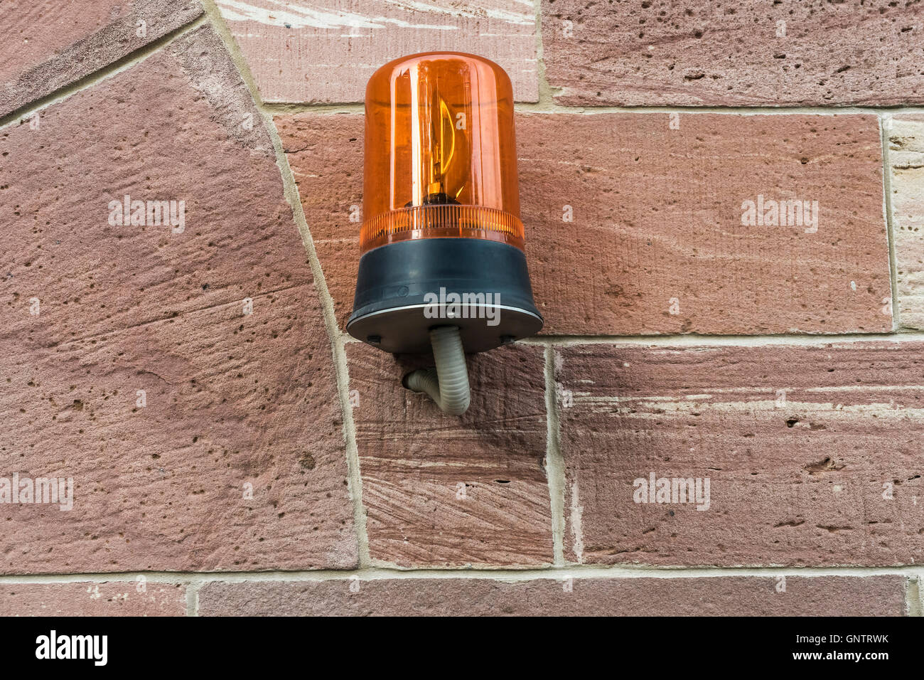 Warning light on a historic wall Stock Photo - Alamy
