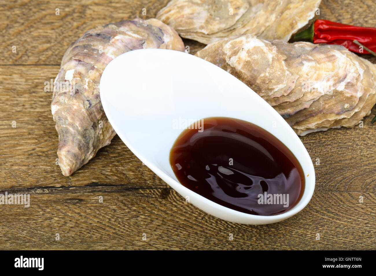 Oyster sauce in the bowl with shell Stock Photo - Alamy