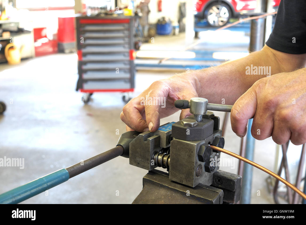auto mechanic manufactures a copper brake pipe Stock Photo - Alamy