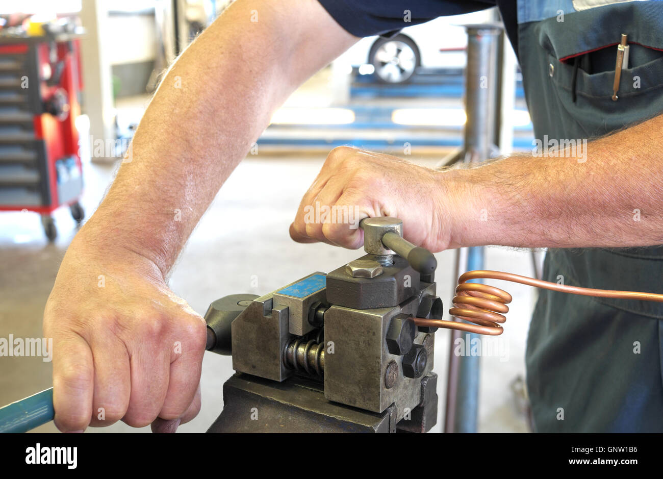 auto mechanic manufactures a copper brake pipe Stock Photo - Alamy