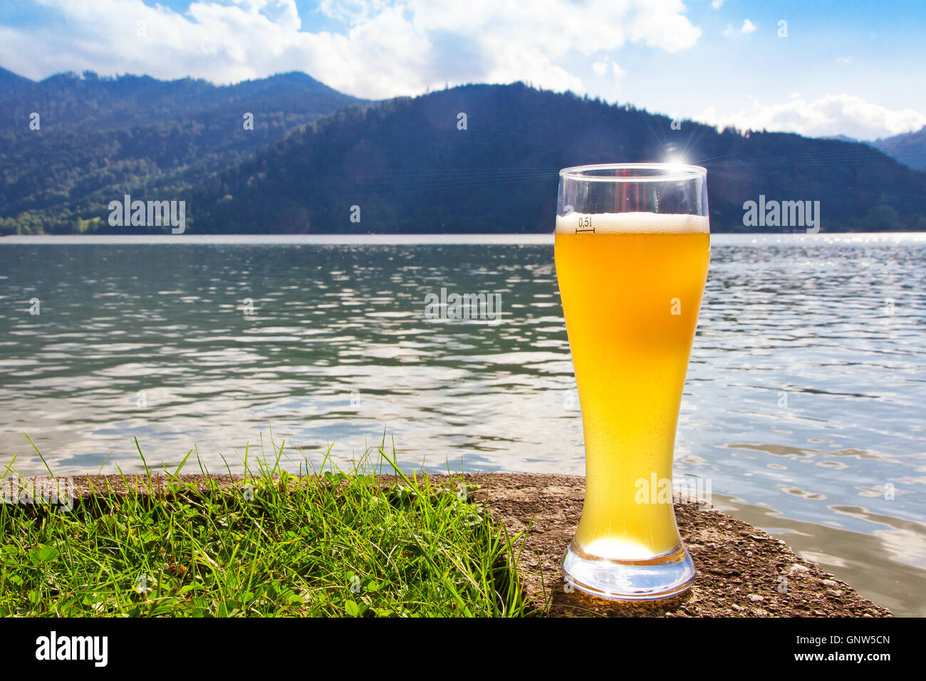 Drinking a wheat beer on a lake Stock Photo - Alamy