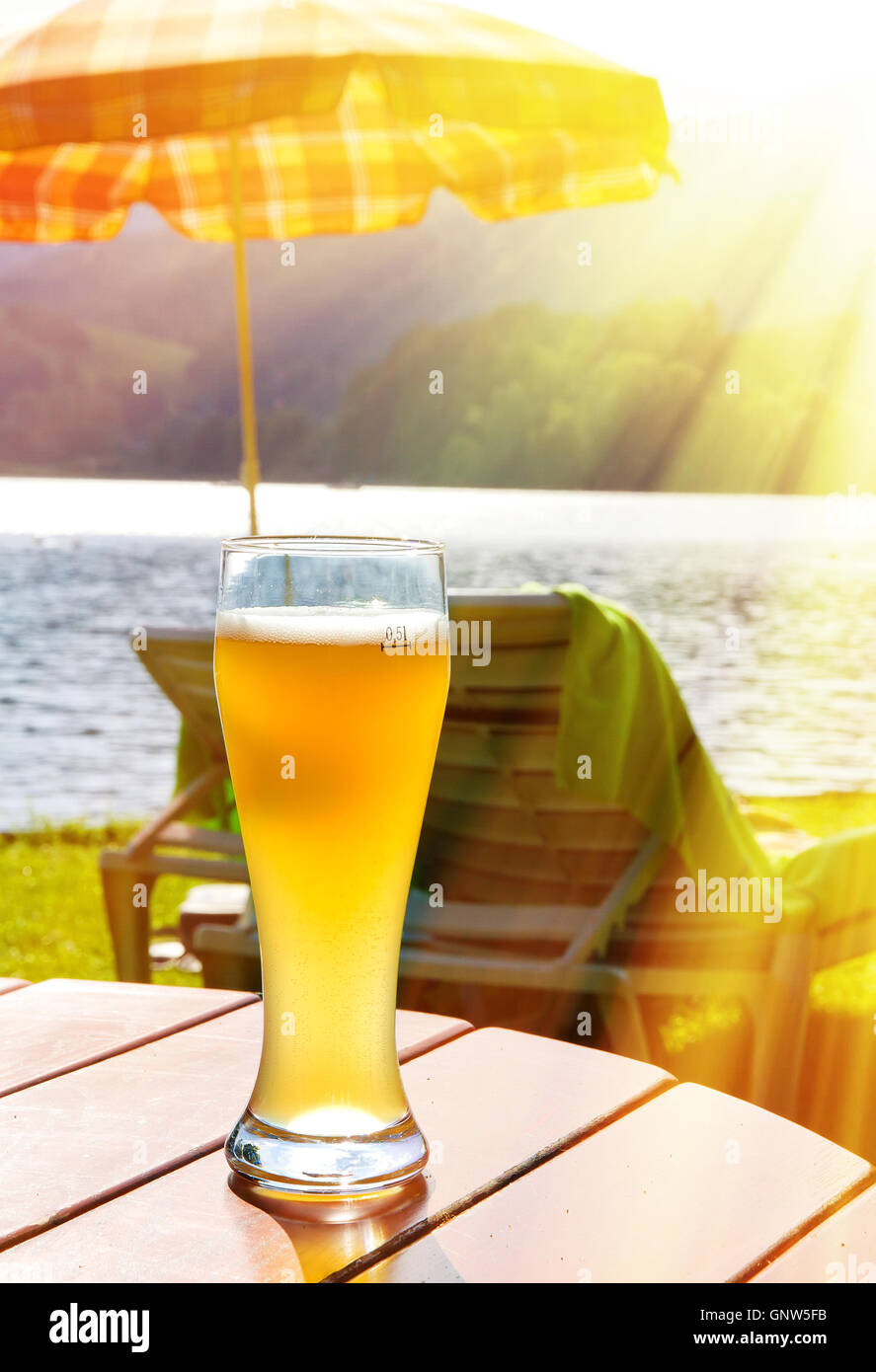 Drinking a wheat beer in the sun Stock Photo - Alamy