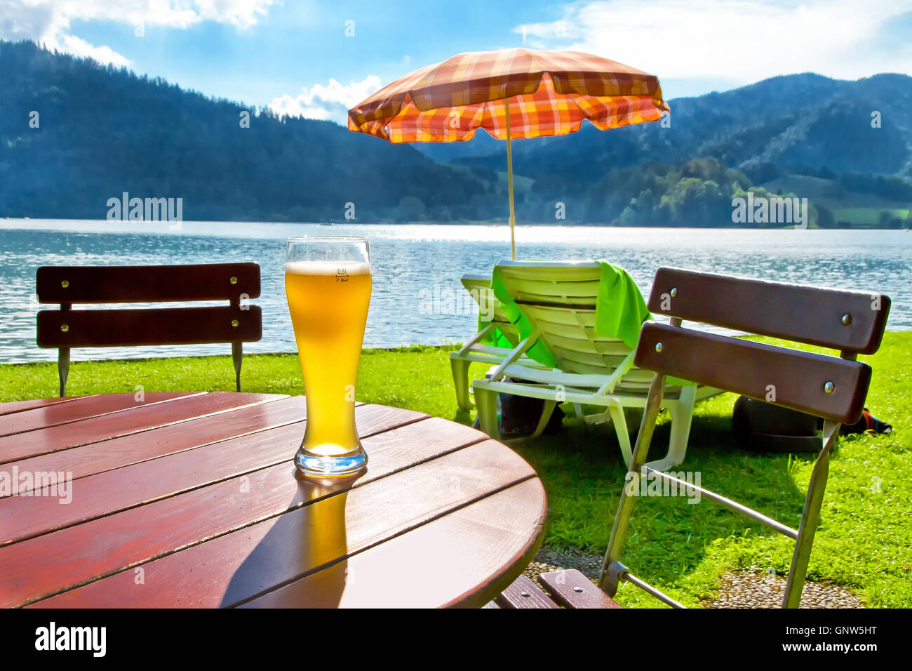 Drinking wheat beer on a lake Stock Photo - Alamy
