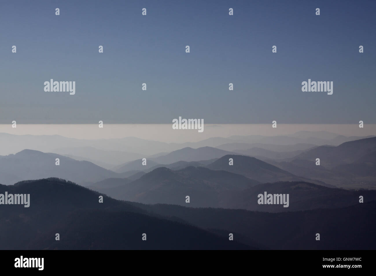 Mountains in mist Stock Photo - Alamy