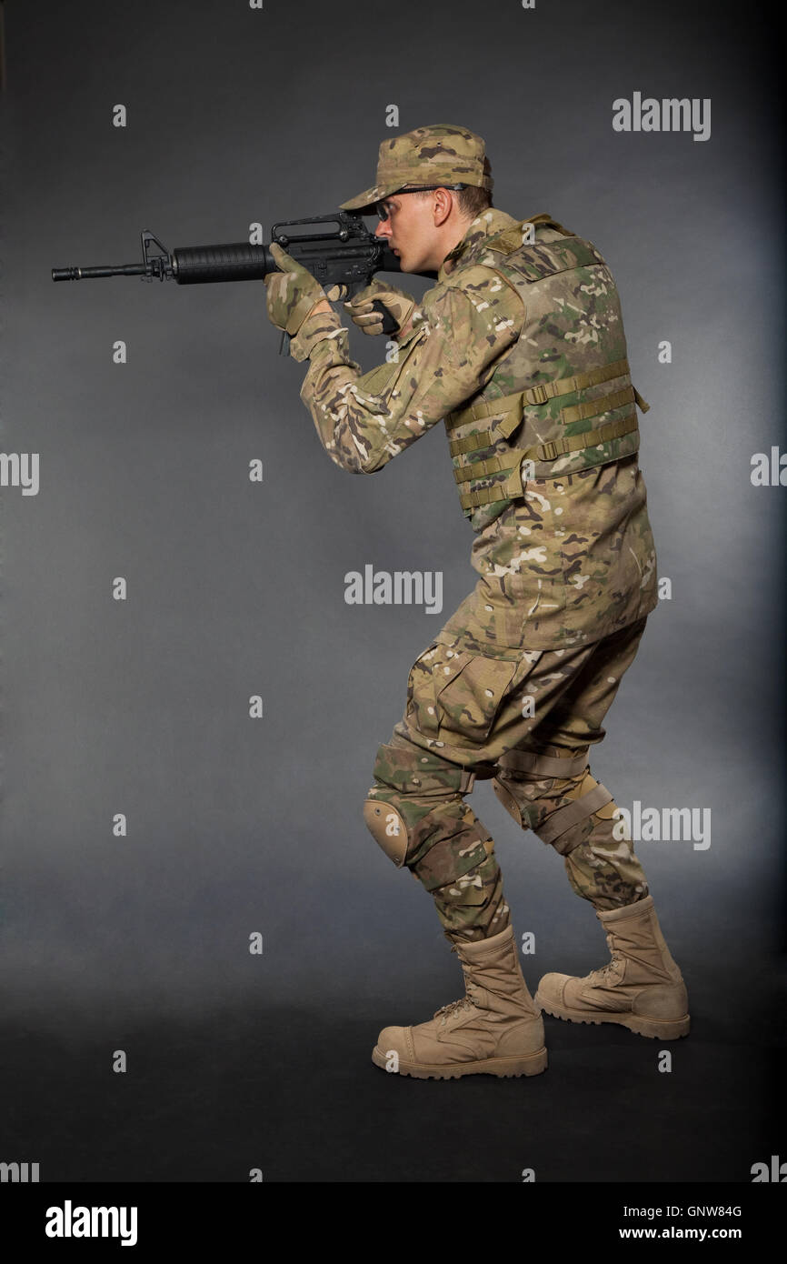 Soldier with rifle Stock Photo - Alamy