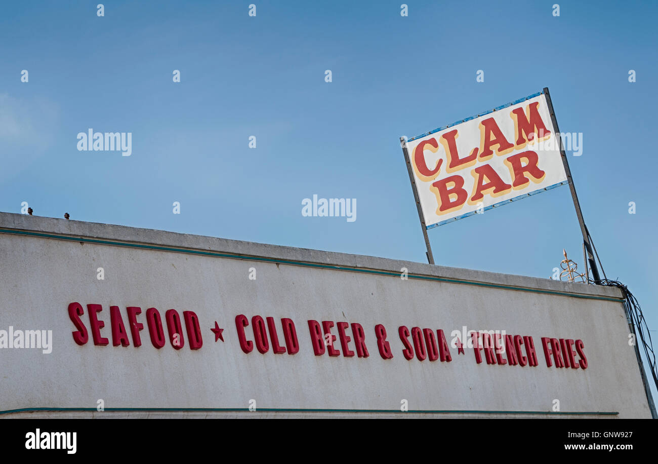 Clam bar sign and red writing on the side of the building in Coney ...