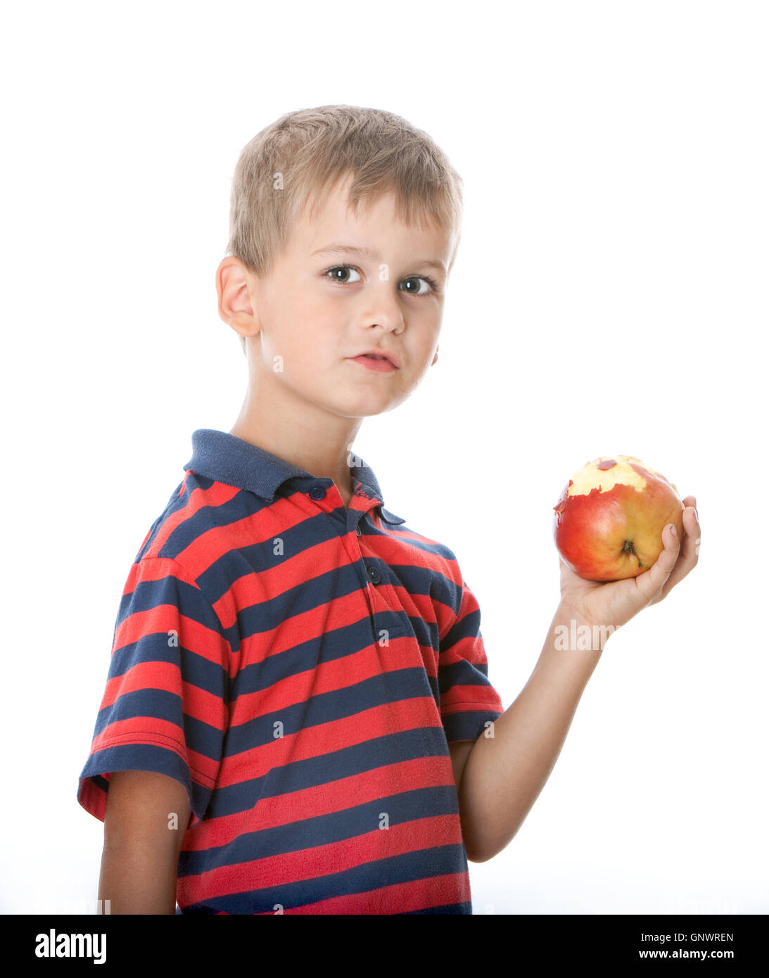 Boy holding an apple Stock Photo - Alamy