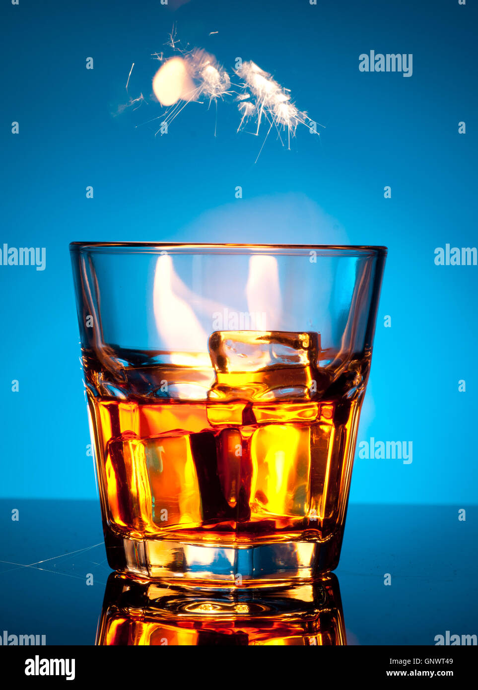 Glass of scotch whiskey and ice Stock Photo - Alamy