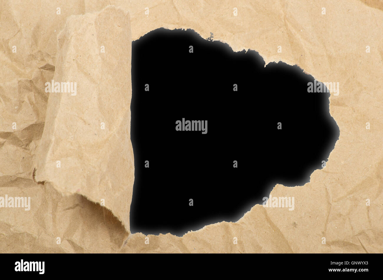ripped white paper against a black background Stock Photo - Alamy