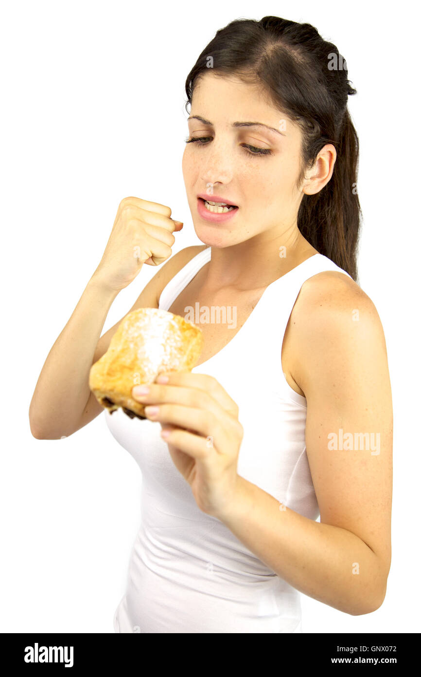 Beautiful girl trying to be on a diet fighting sweet Stock Photo - Alamy