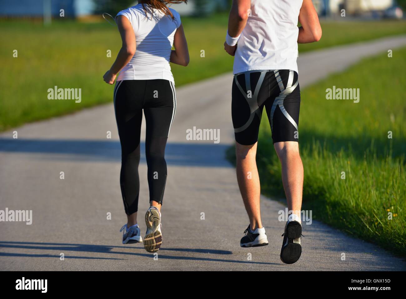 Young couple jogging Stock Photo - Alamy