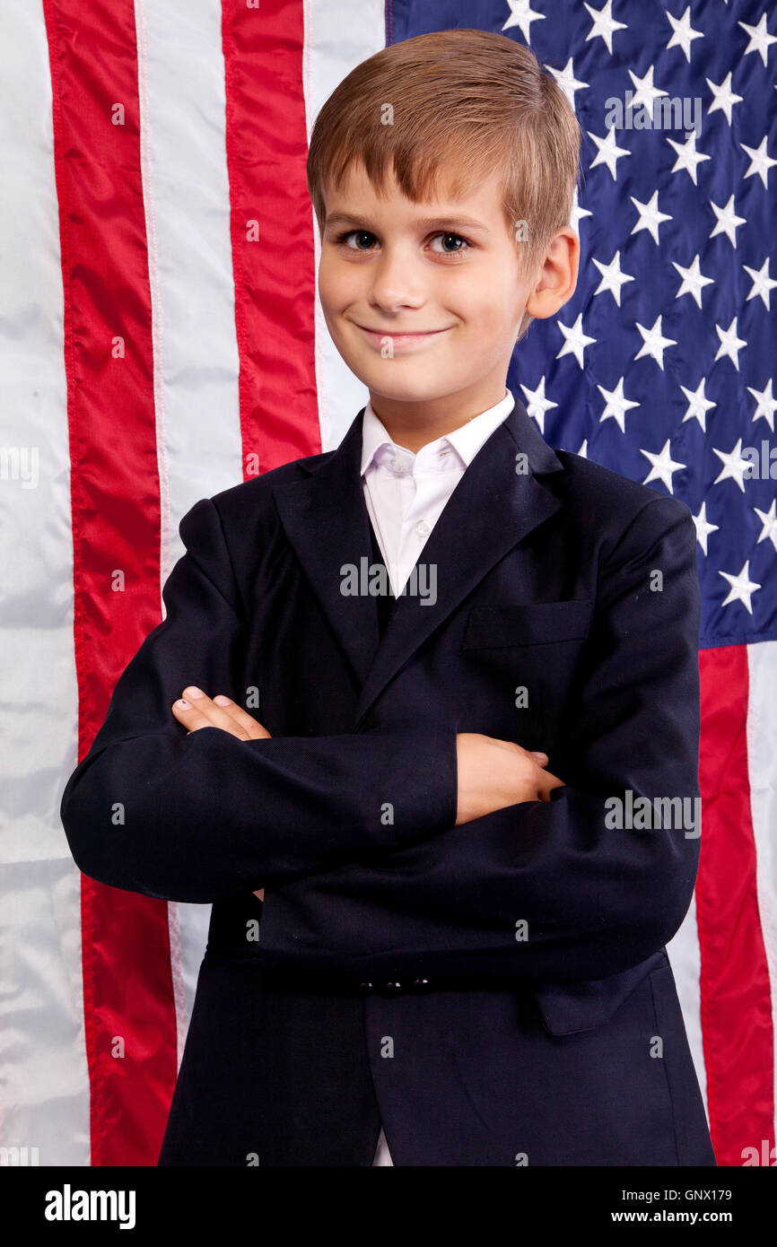 Portait of Caucasian boy with American flag in background Stock Photo ...