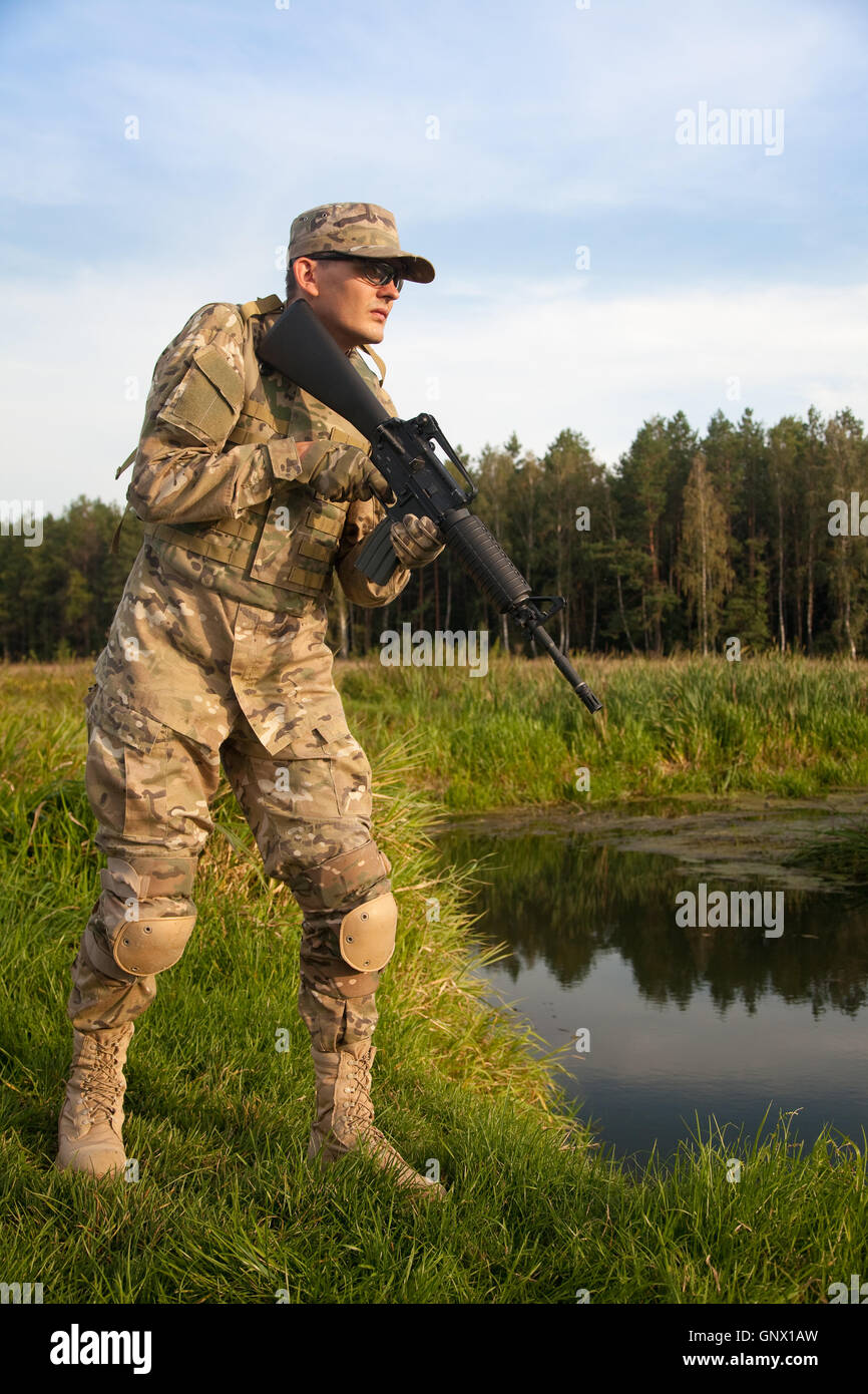 Soldier with a rifle Stock Photo - Alamy