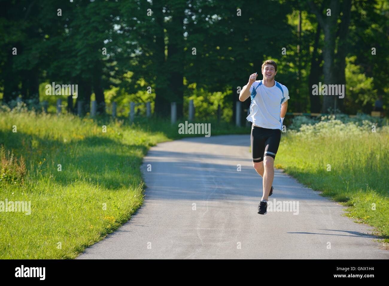Young beautiful woman jogging Stock Photo - Alamy