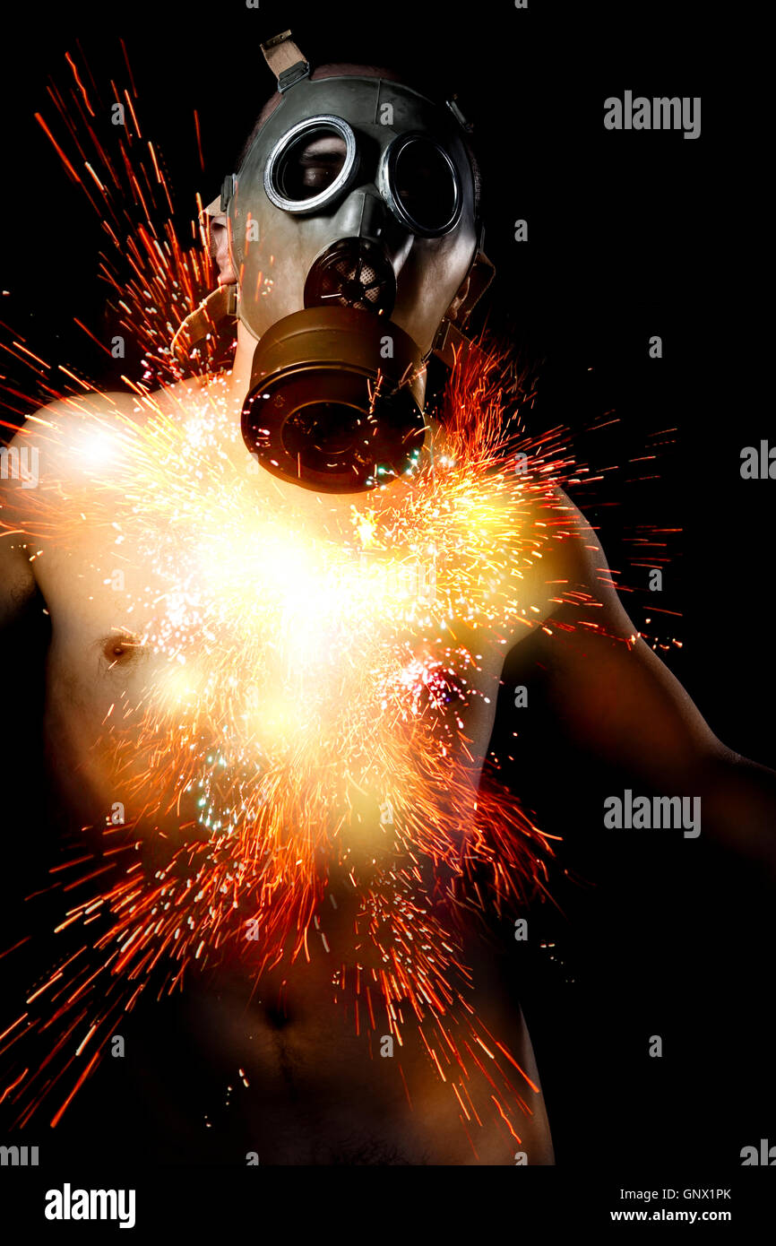 Nuclear disaster, man with gas mask, chest out fireworks Stock Photo ...