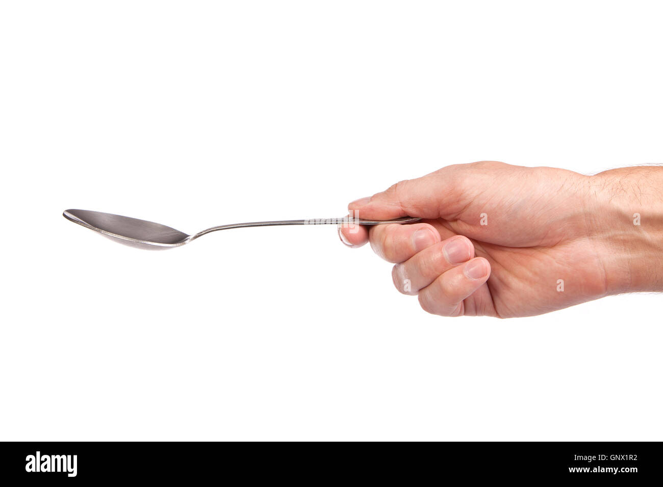 Hand is holding a spoon isolated Stock Photo - Alamy